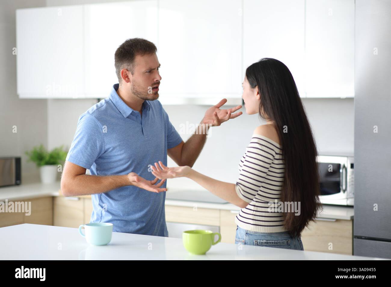 Angry interracial couple having relationship hi-res stock photography ...
