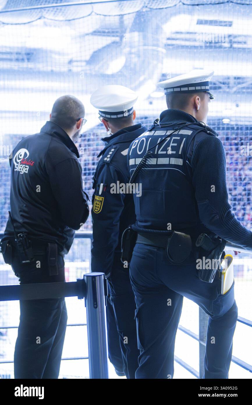 Police officers monitor stadium security during a sporting event ...