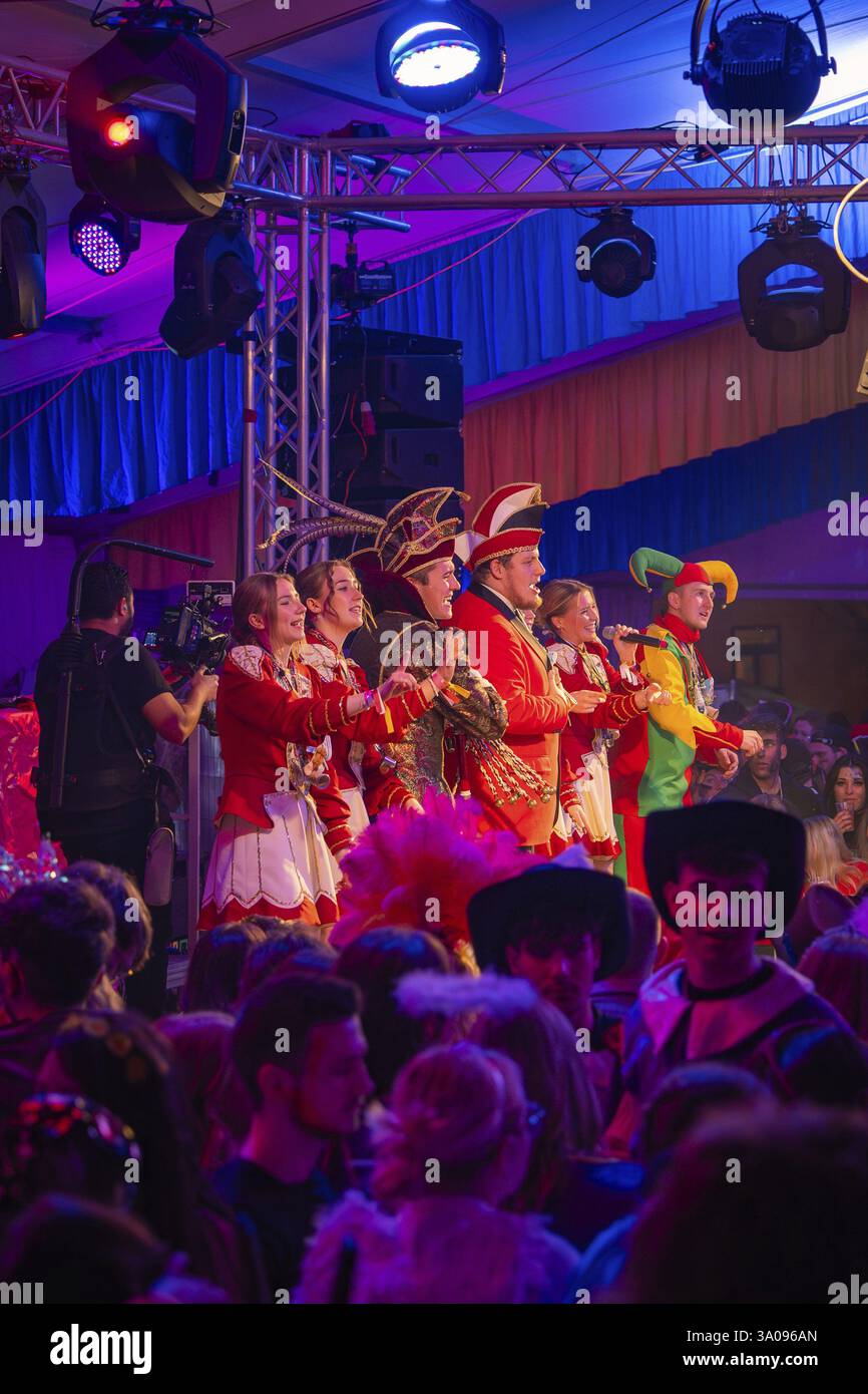 Performance of people in colourful costumes on a stage during a ...