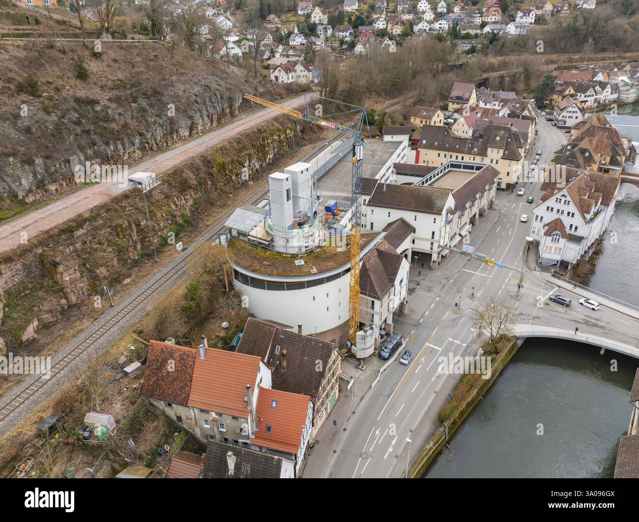 View of a small village with a modern building project in the centre ...