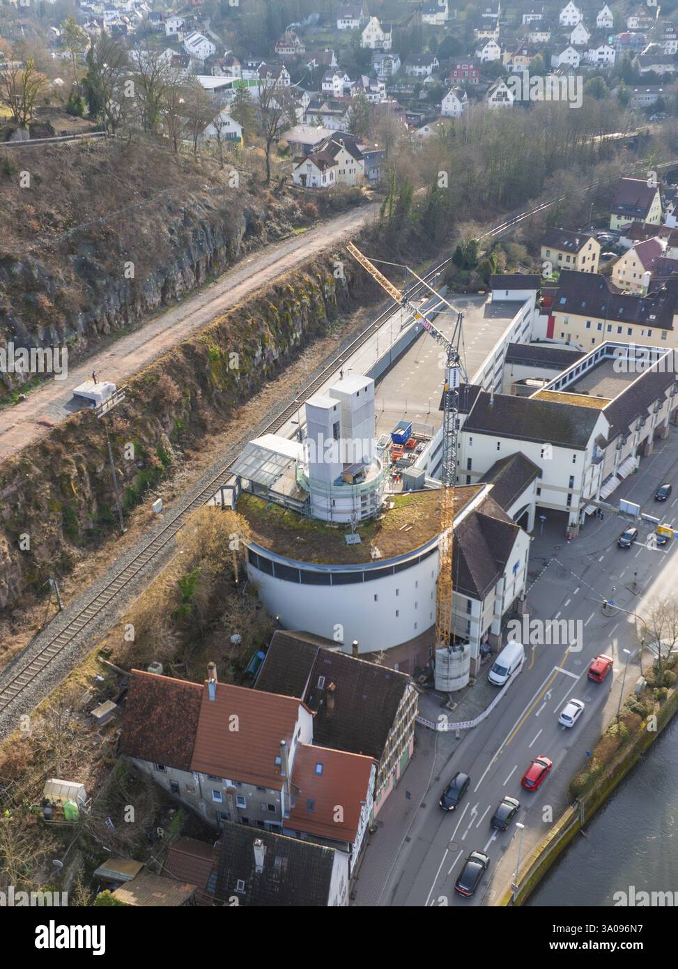 Urban landscape with crane, buildings and river, photographed from a ...
