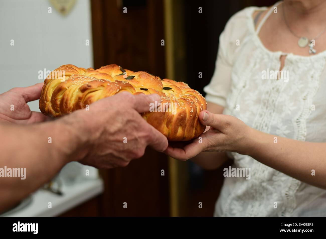 Husband and wife holding a traditional Serbian slava cake Stock Photo ...