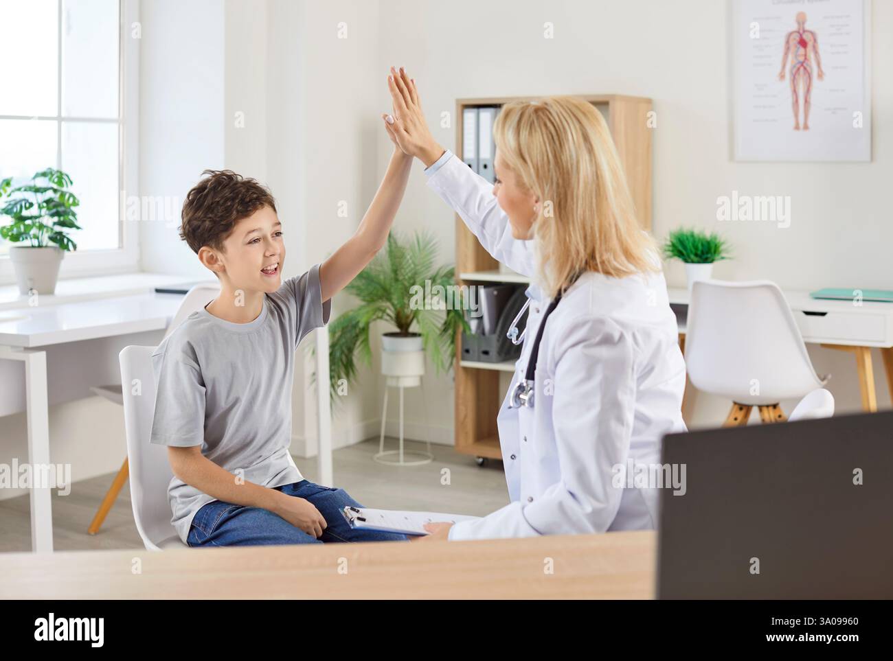 Boy Patient Giving High Five To Doctor Or Nurse During Hospital ...