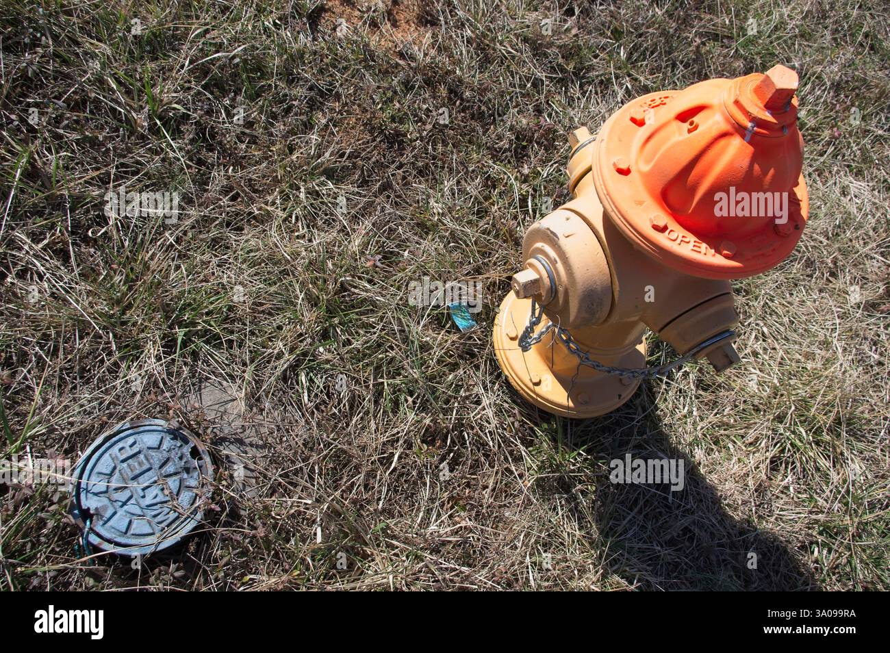 Fire hydrant and water valve in a grassy field Stock Photo - Alamy