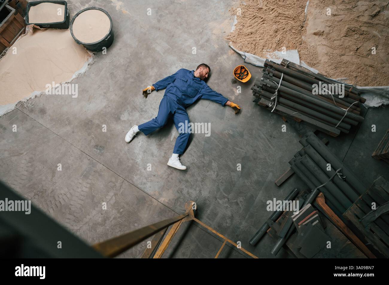 Top view of dead factory worker that lying on the ground. Conception of ...