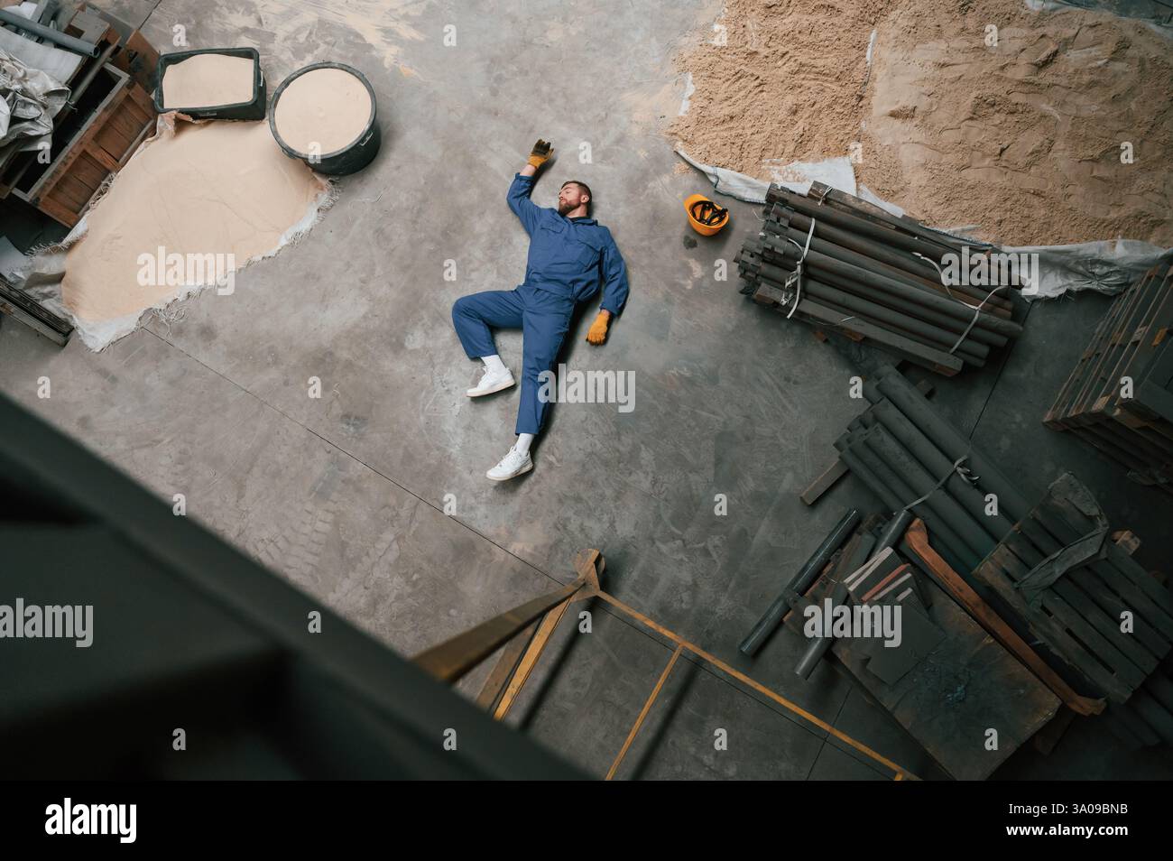Top view of dead factory worker that lying on the ground. Conception of ...