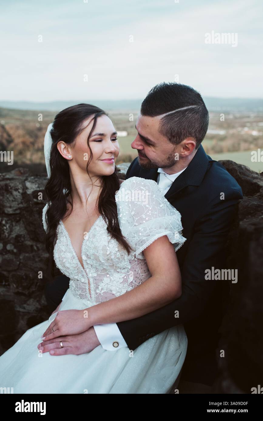 Bride and groom looking at each other lovingly, portrait Stock Photo ...