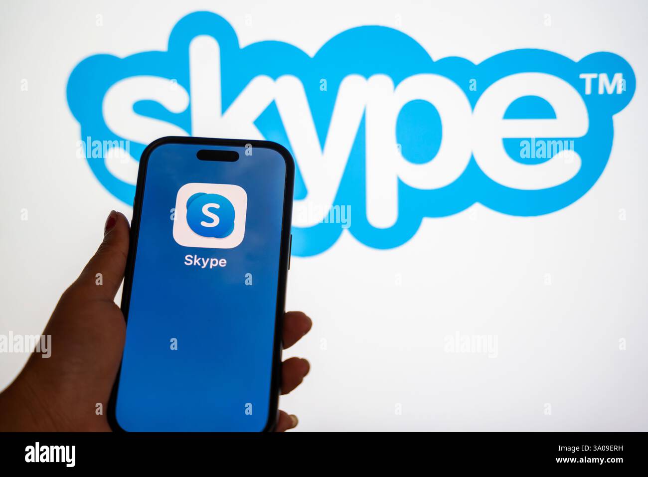 March 3, 2025: In this photo illustration, a person holds a mobile phone displaying Skype ...