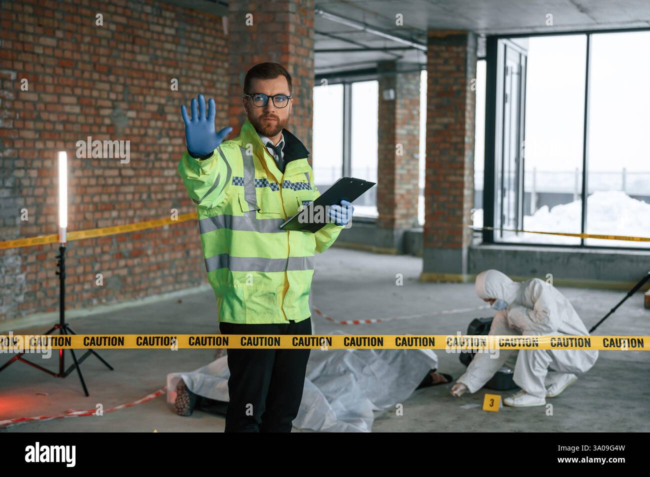 Stop gesture by a hand, no trespassing. Detectives are collecting ...