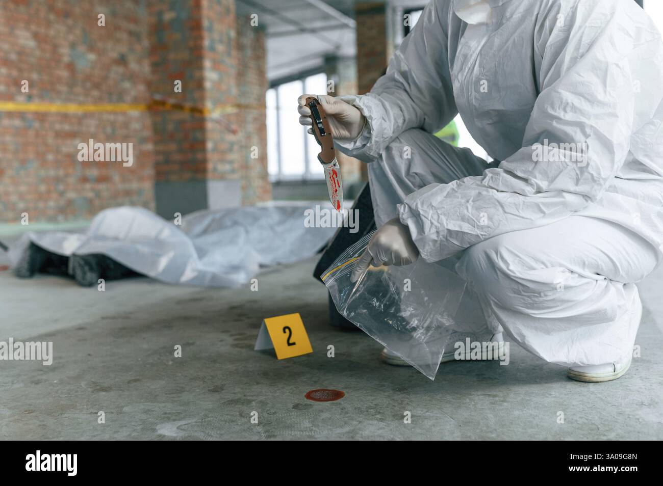 At daytime. Detectives are collecting evidence in a crime scene near ...