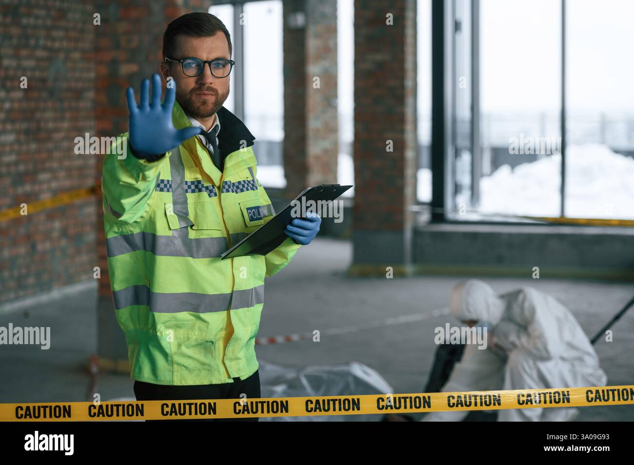 Stop gesture by a hand, no trespassing. Detectives are collecting ...