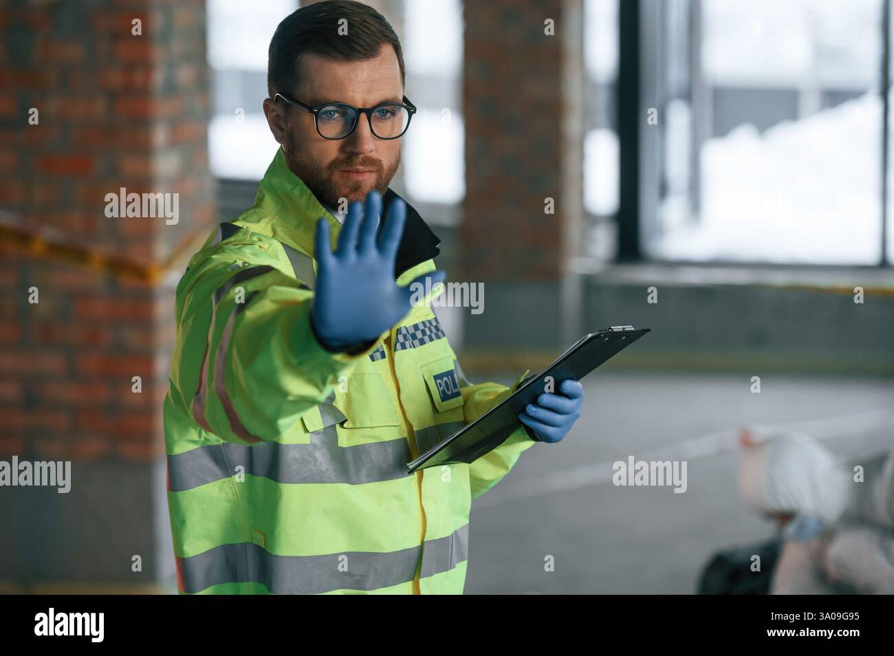 Stop gesture by a hand, no trespassing. Detectives are collecting ...