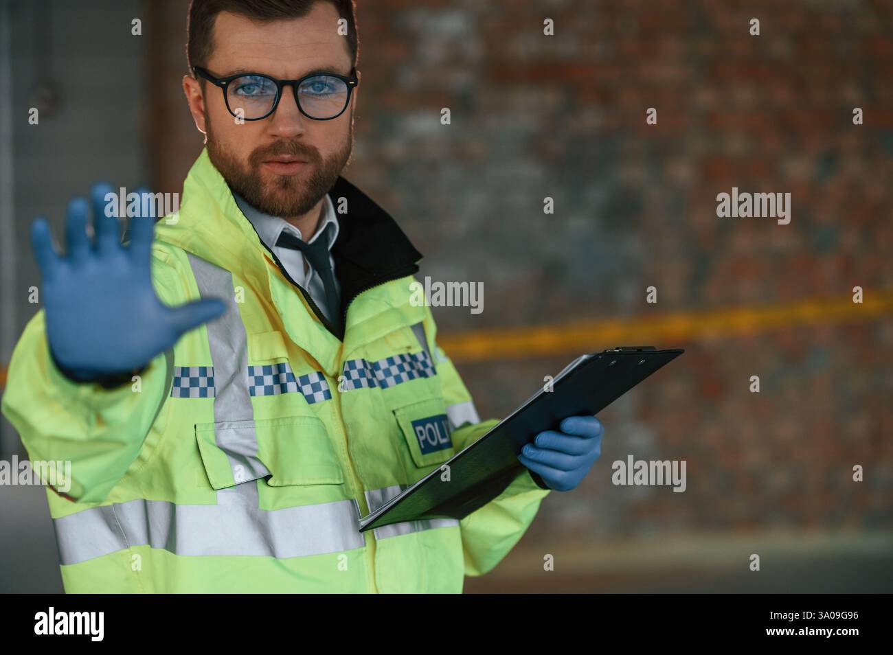 No trespassing, stop gesture by a hand. Male detective is collecting ...