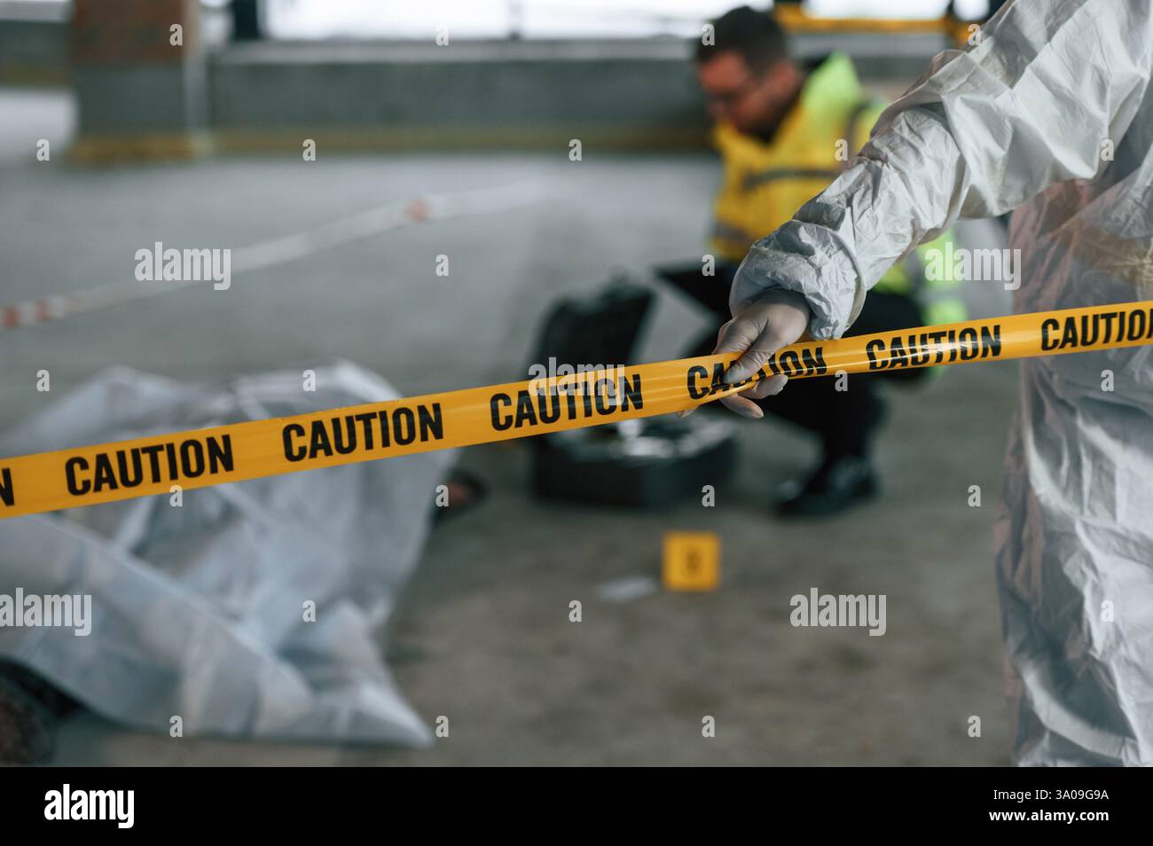 Close up view of caution police tape. Detectives are collecting ...