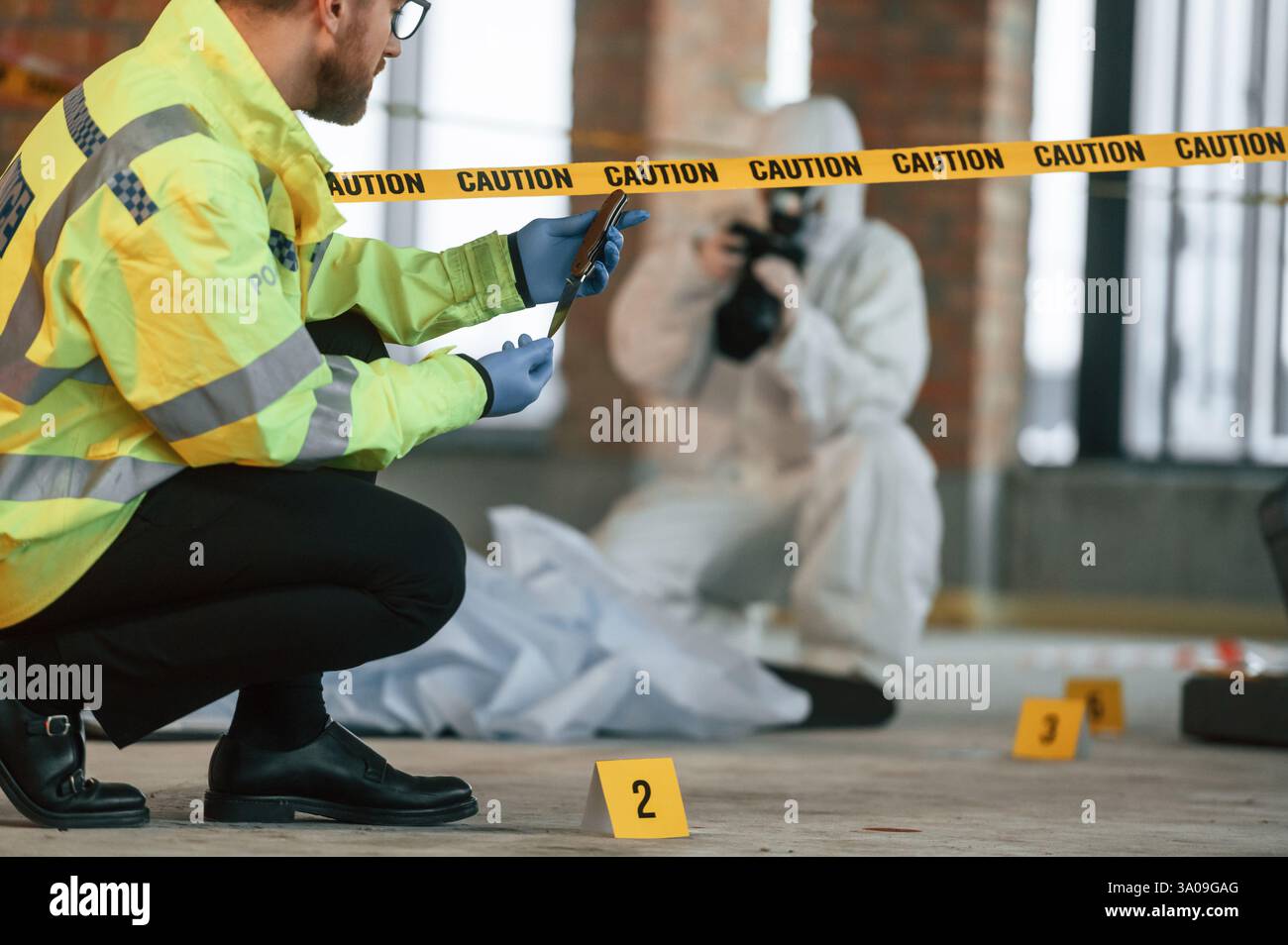 Woman is using camera, making photos. Detectives are collecting ...