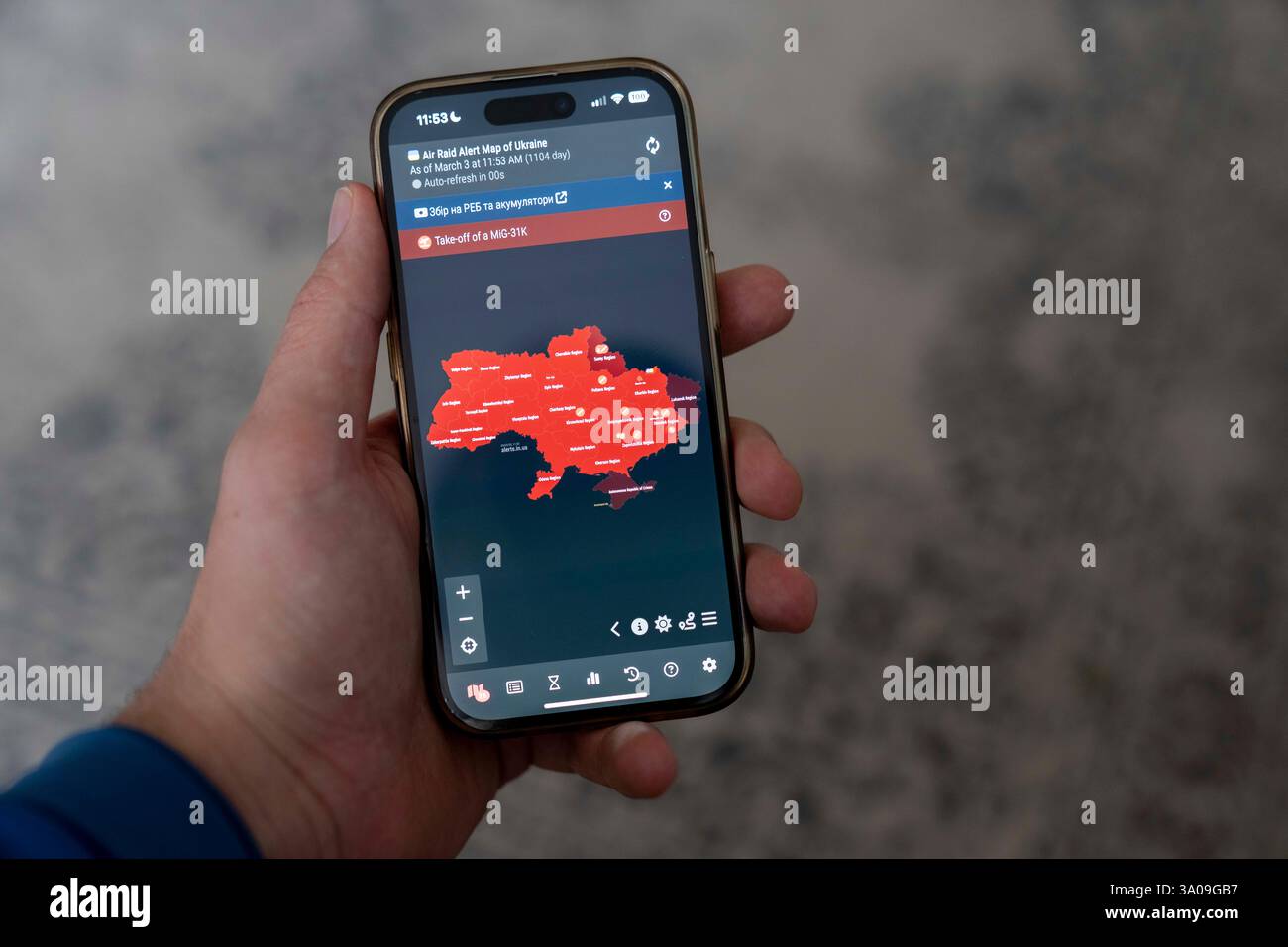Illustrative picture of a person holding smartphone in hand displaying ...