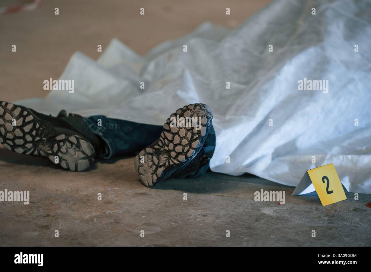 Dead body of a man is on the ground, covered in white cloth. Conception ...