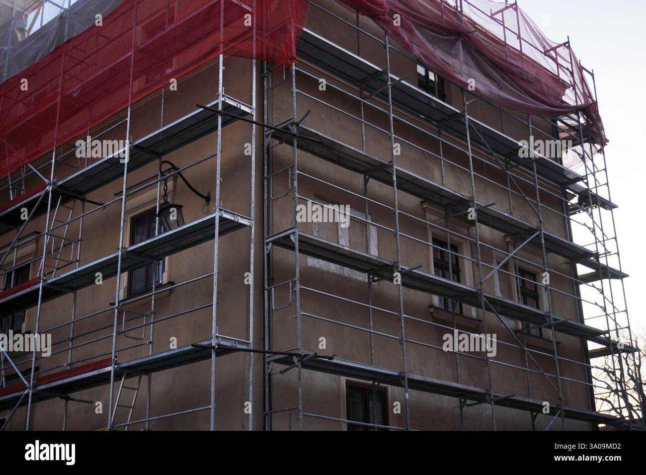 Scaffolding around old building renovation facade Stock Photo - Alamy