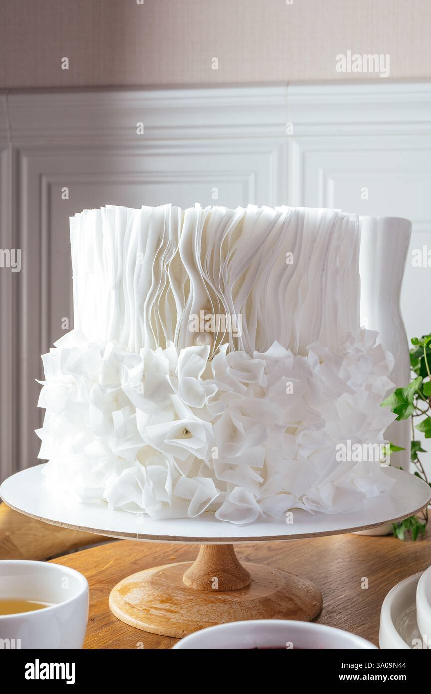 white wedding cake with waves Stock Photo - Alamy