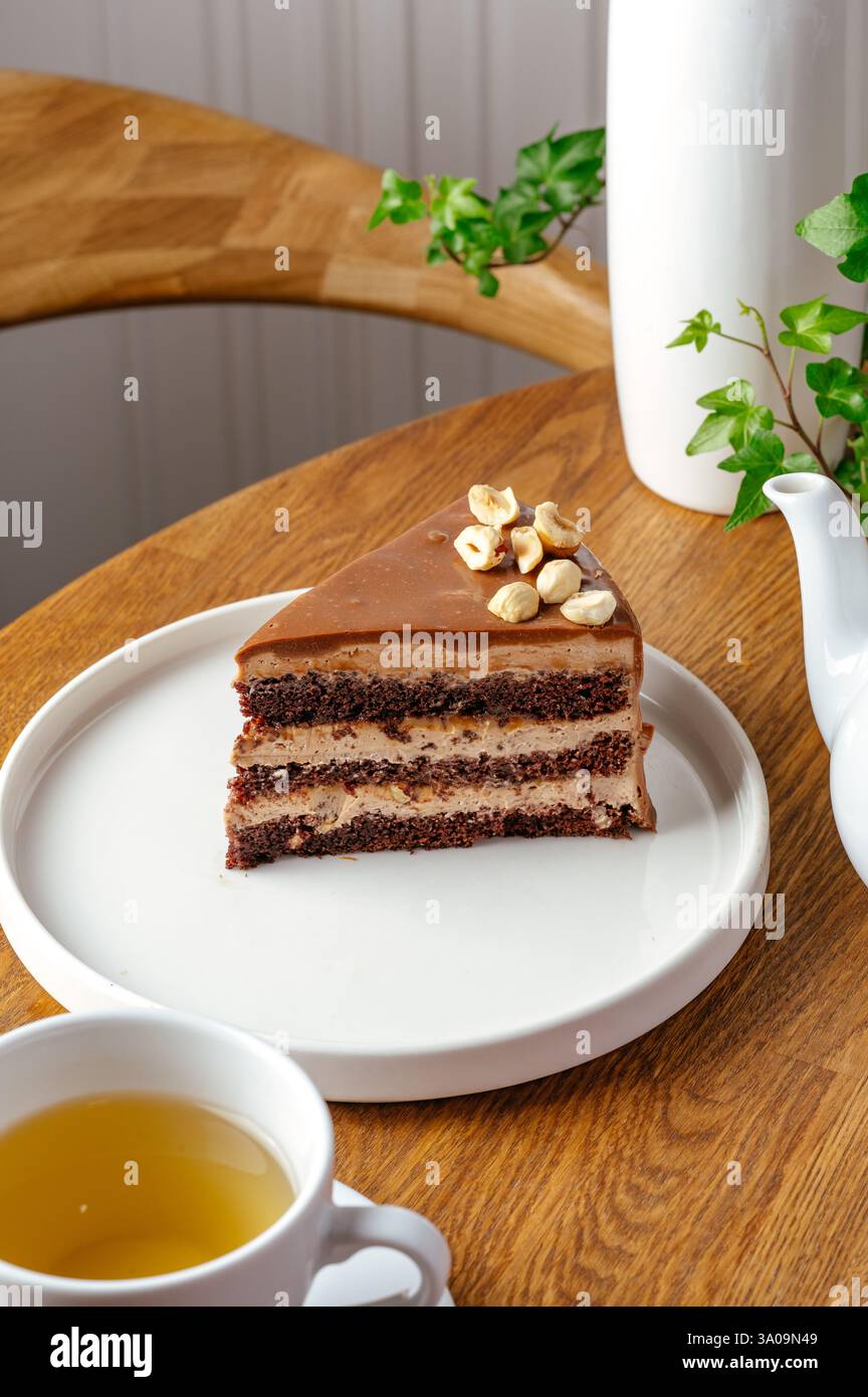 sponge chocolate cake with carmel and hazelnuts Stock Photo - Alamy
