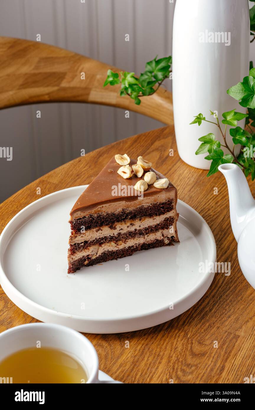 sponge chocolate cake with carmel and hazelnuts Stock Photo - Alamy