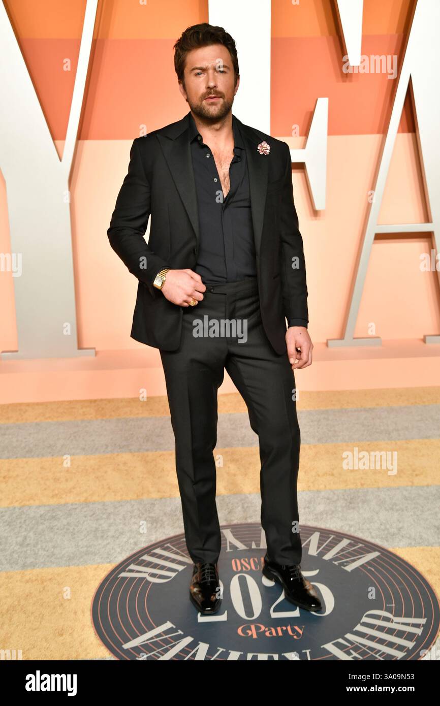Brandon Sklenar arrives at the Vanity Fair Oscar Party on Sunday, March ...