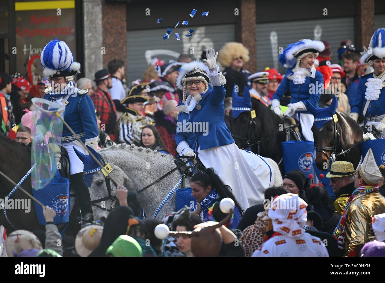 03 March 2025, North Rhine-Westphalia, Cologne: Carnival revelers throw ...
