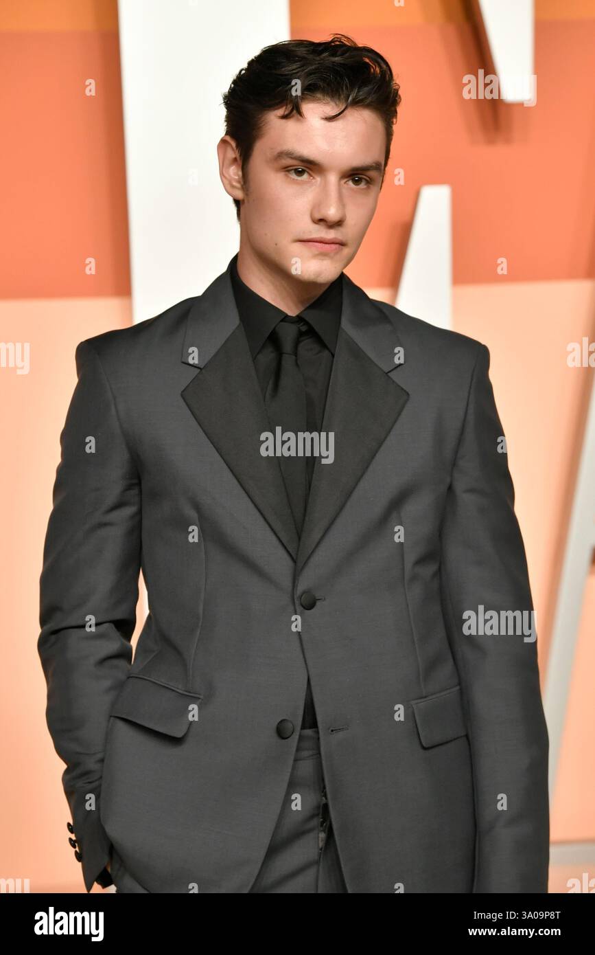 Louis Partridge arrives at the Vanity Fair Oscar Party on Sunday, March ...