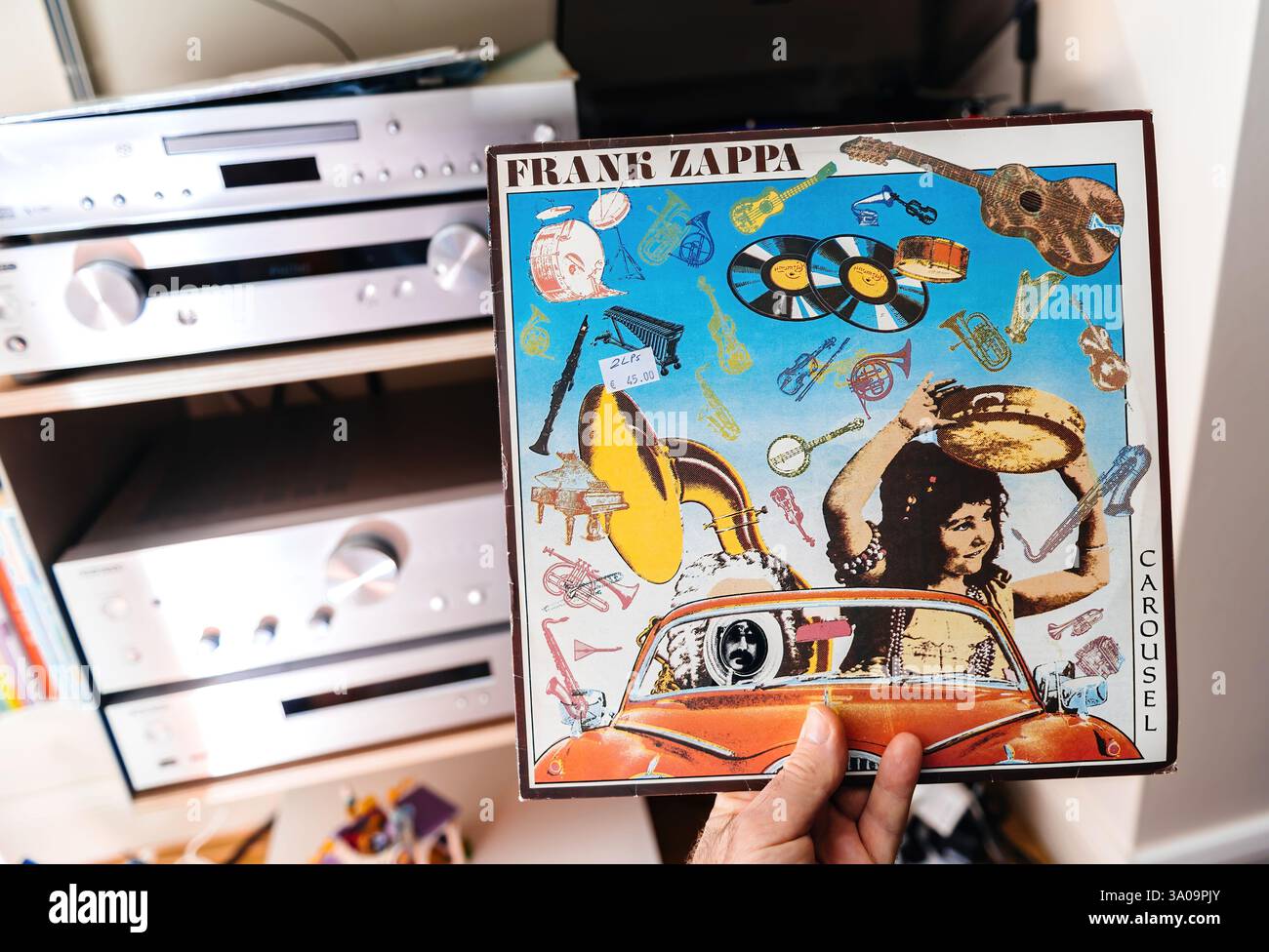 Paris, France - Feb 17, 2025: A person holds a Frank Zappa Carousel ...