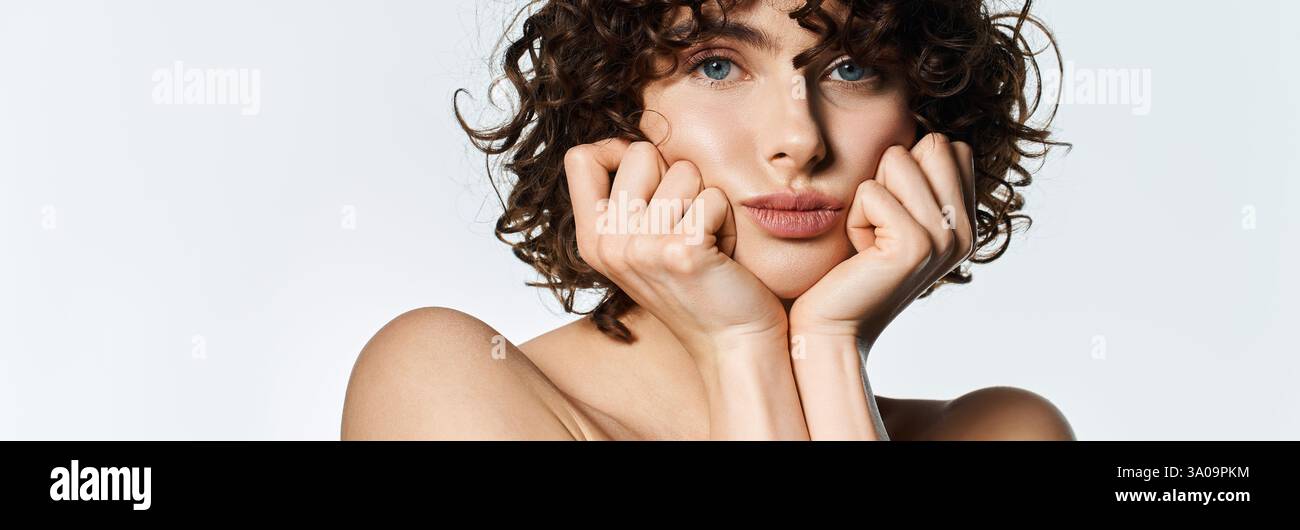 Young woman with curly hair showcases beauty through graceful poses and ...