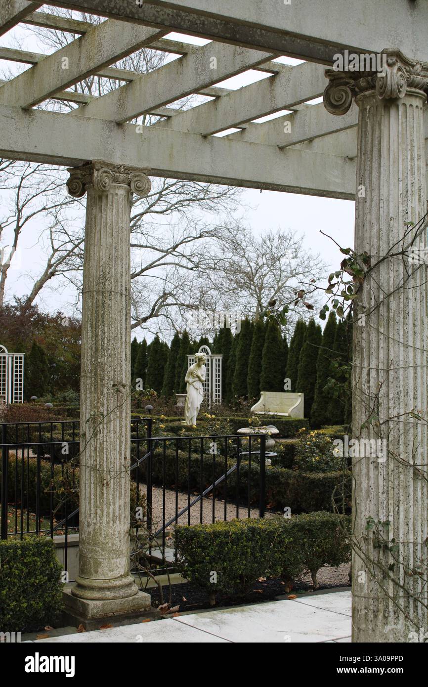 Statue hidden deep within a lush garden Stock Photo - Alamy