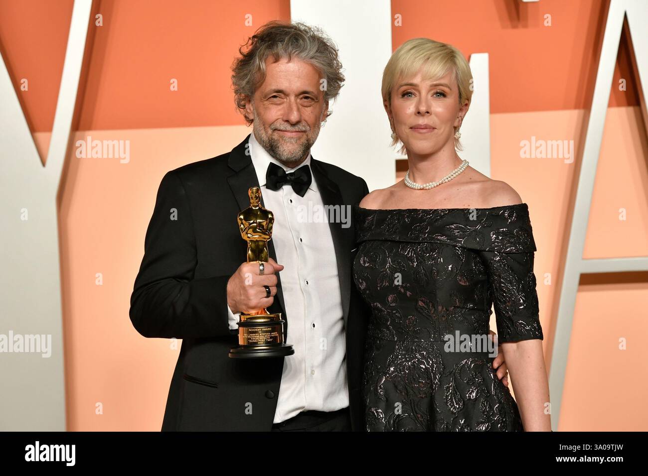 Paul Lambert, left, arrives at the Vanity Fair Oscar Party on Sunday ...