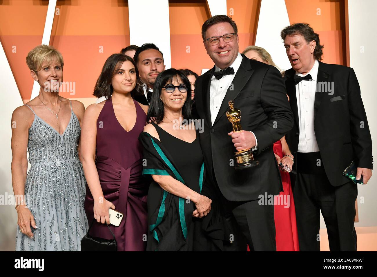 Ron Bartlett, second from right, arrives at the Vanity Fair Oscar Party ...