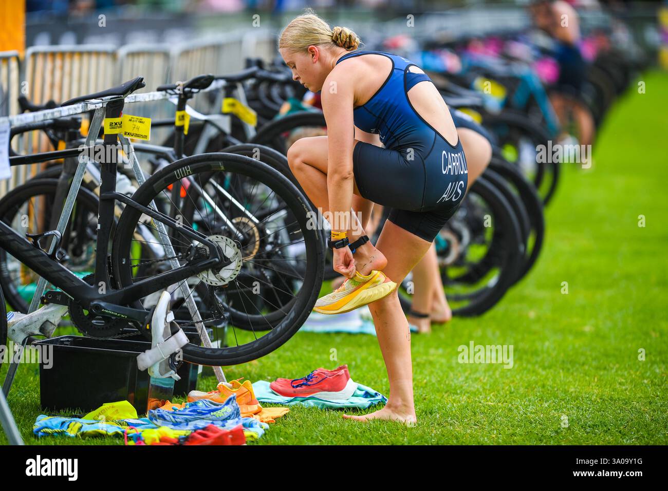 Madigan Carroll is seen in transition between bike and run stages during Race 5 of the 2XU ...