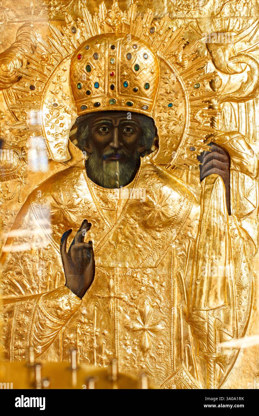 an old icon of Saint Nicholas with frame covered with gold in Sludyanka ...