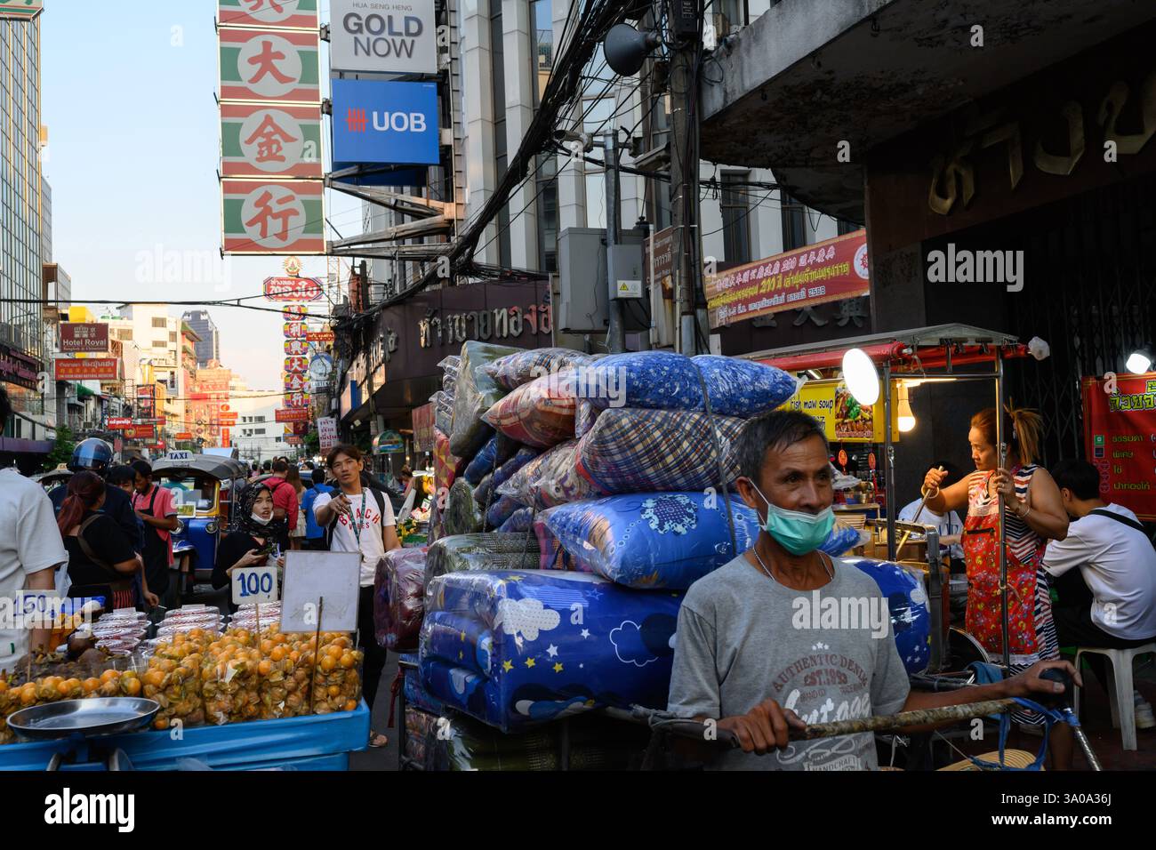 Bangkok, Thailand. February 18th 2025. A local porter in a the crowded ...