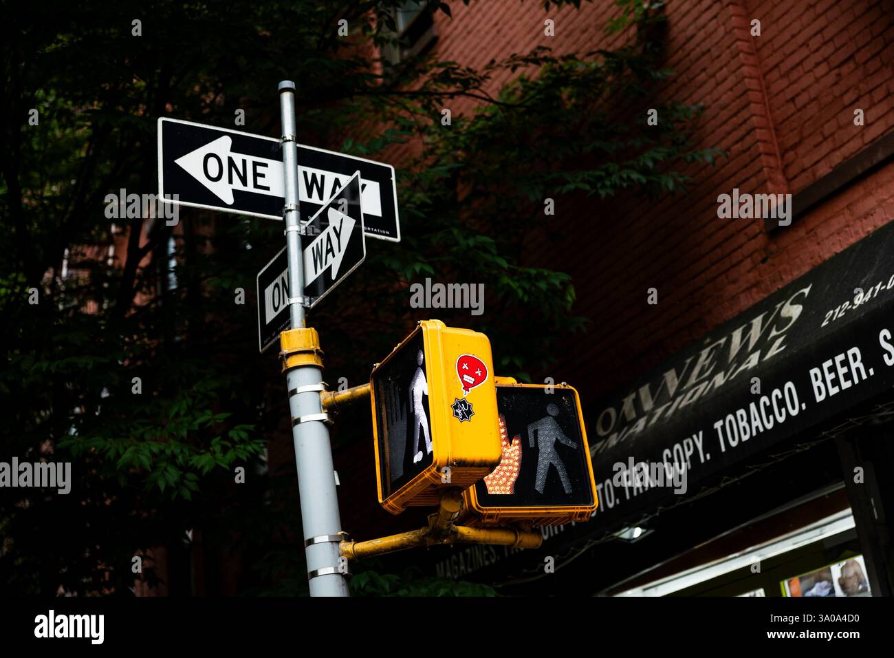 Street view of traffic lights and directions in Soho, New York Stock ...