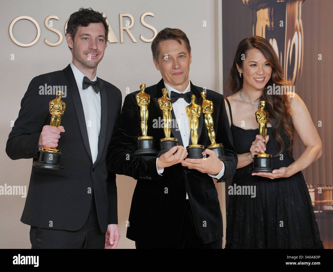 (L-R) Alex Coco, Sean Baker, and Samantha Quan, winners of the Best Picture for “Anora”, posing ...