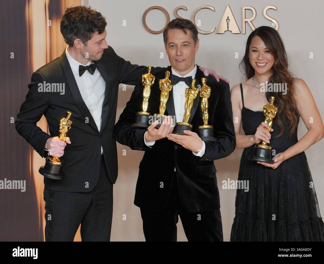 (L-R) Alex Coco, Sean Baker, and Samantha Quan, winners of the Best Picture for “Anora”, posing ...