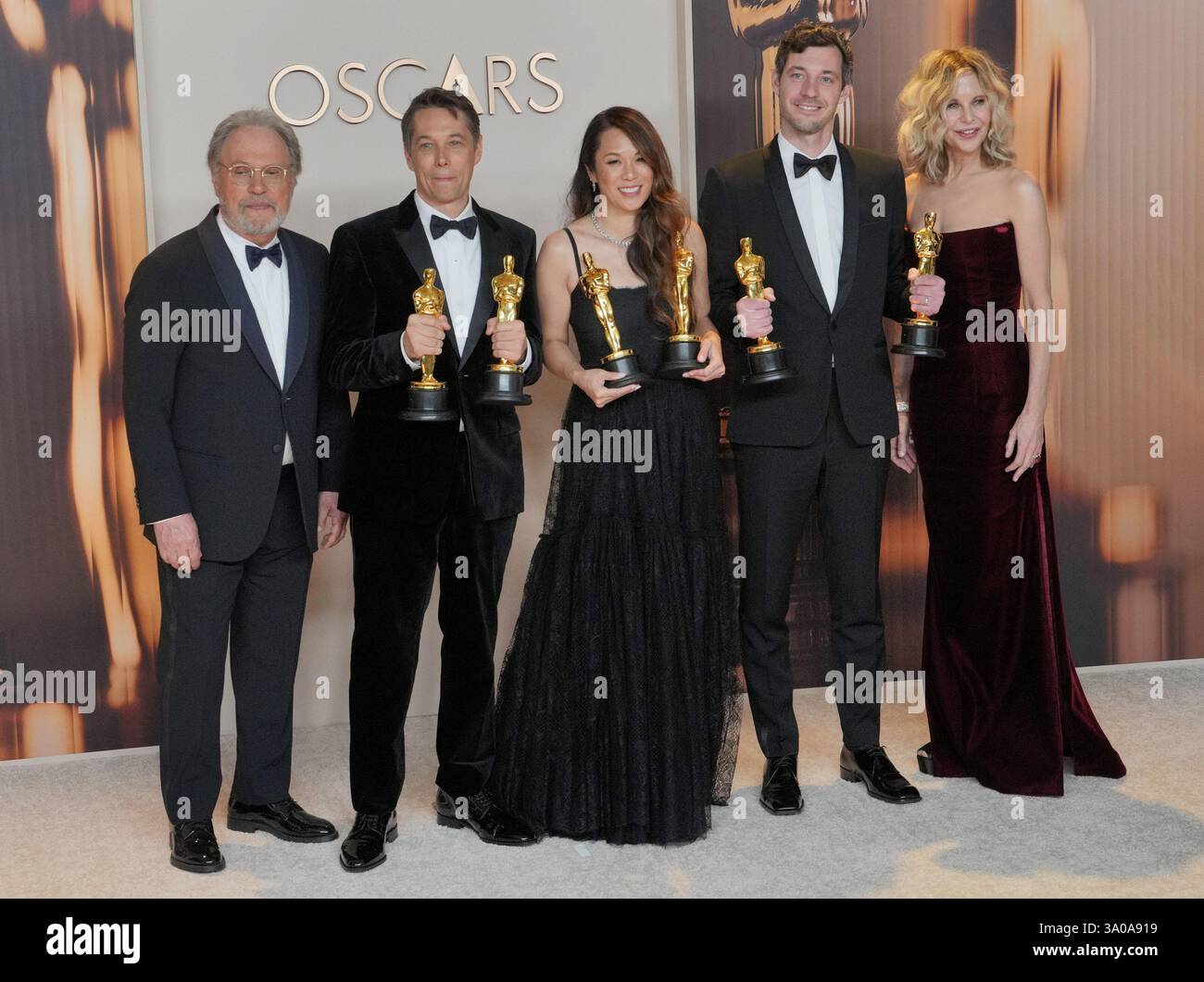 Sean Baker, Samantha Quan, and Alex Coco, winners of the Best Picture for “Anora”, pose in the ...