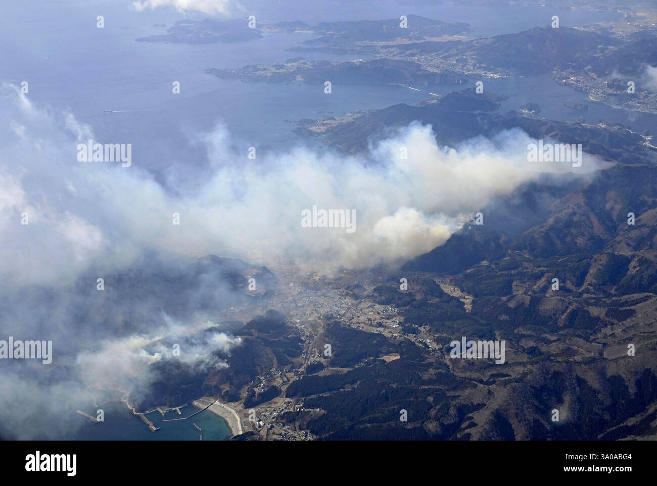 This aerial photo shows a forest fire in Ofunato city, Iwate prefecture ...