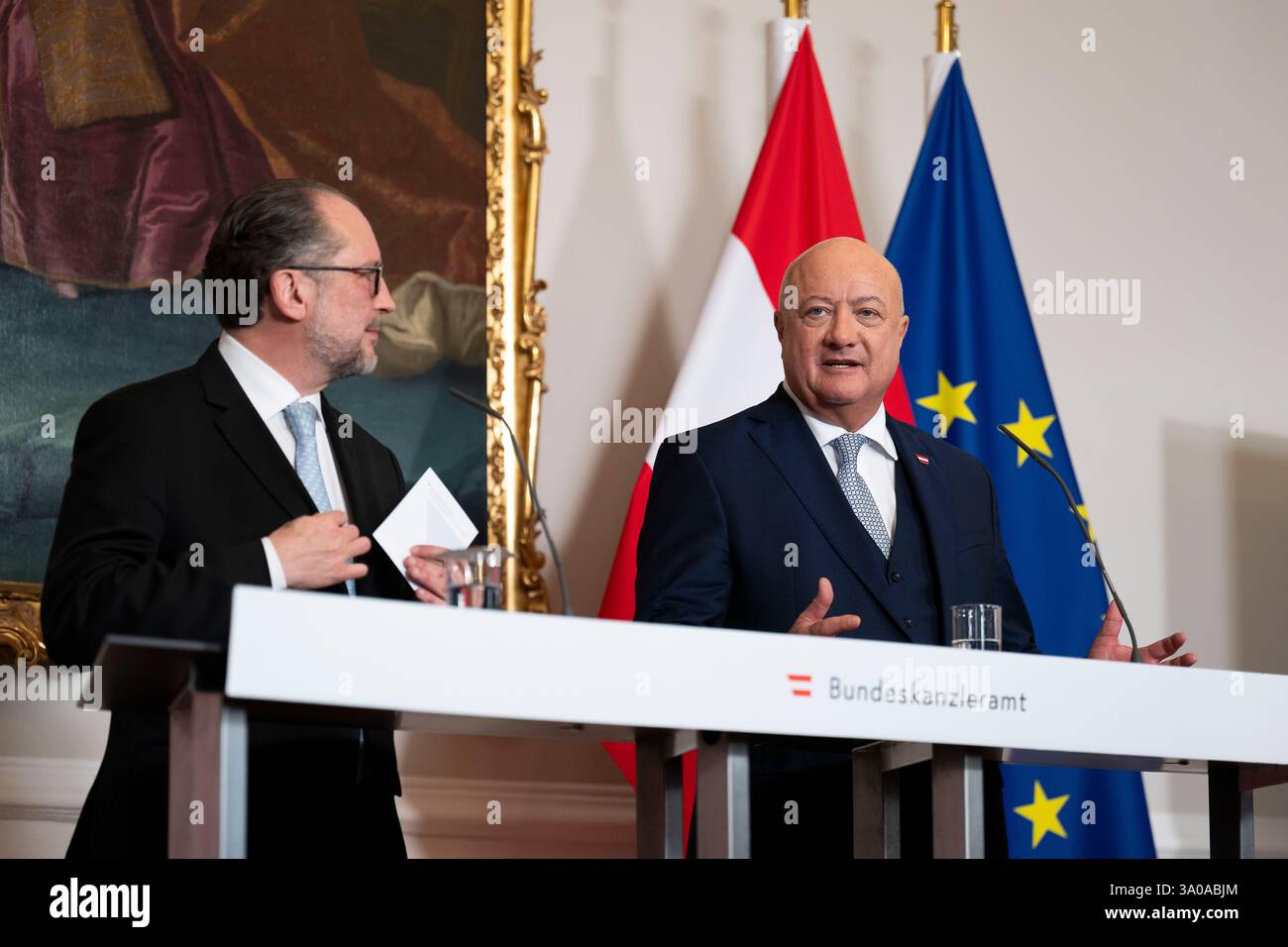 Austria's newly sworn-in Chancellor Christian Stocker, right, makes a ...