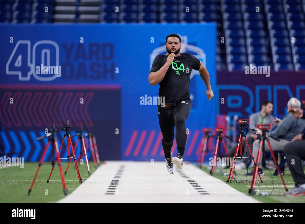 Kansas offensive lineman Logan Brown runs the 40-yard dash at the NFL ...