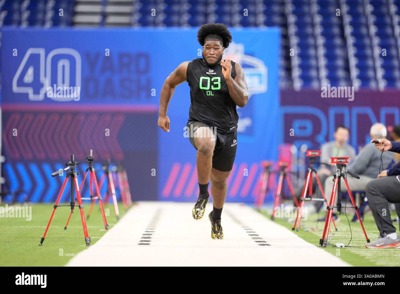 Alabama offensive lineman Tyler Booker runs the 40-yard dash at the NFL ...