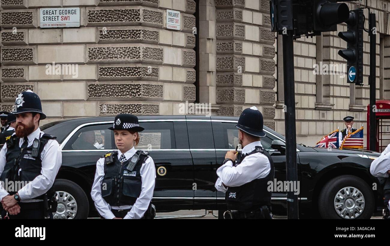 President Donald Trump rides in the presidential limousine known as ...