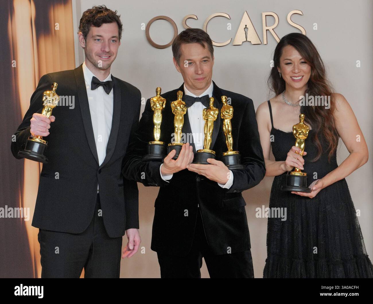 (L-R) Alex Coco, Sean Baker, and Samantha Quan, winners of the Best Picture for “Anora”, posing ...