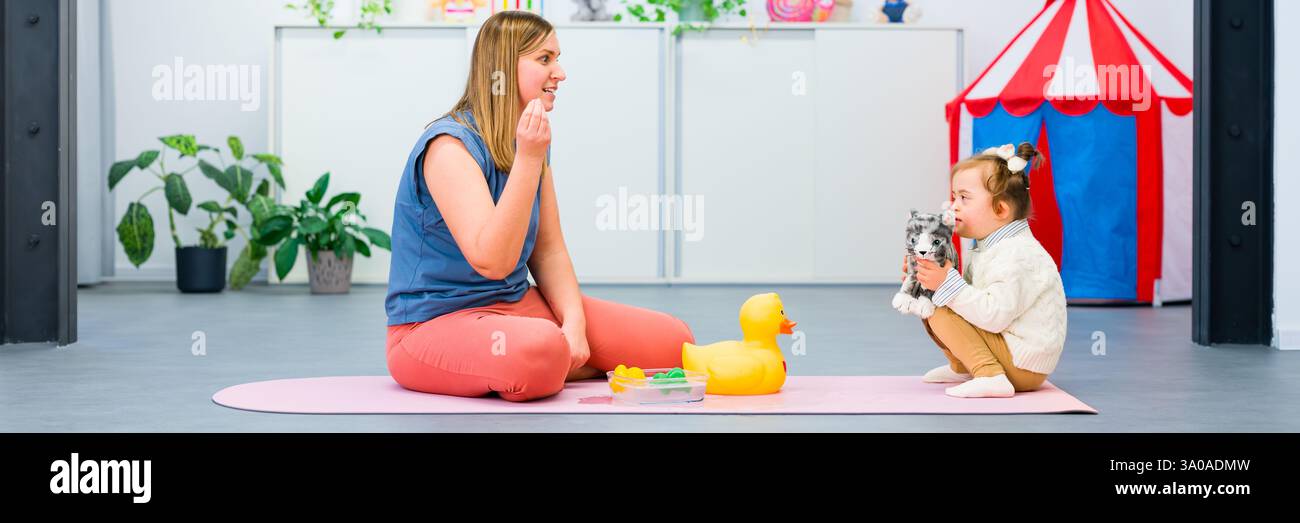 Nonverbal child with Down syndrome learning baby sign language with the ...