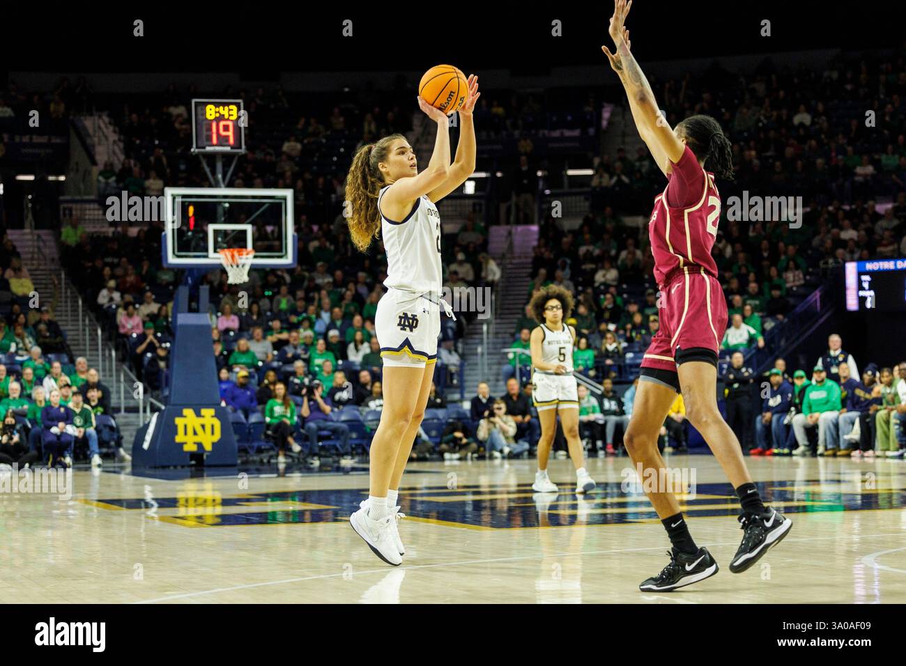 Notre Dame forward Maddy Westbeld (21) shoots over Florida State forward Malea Williams, right ...