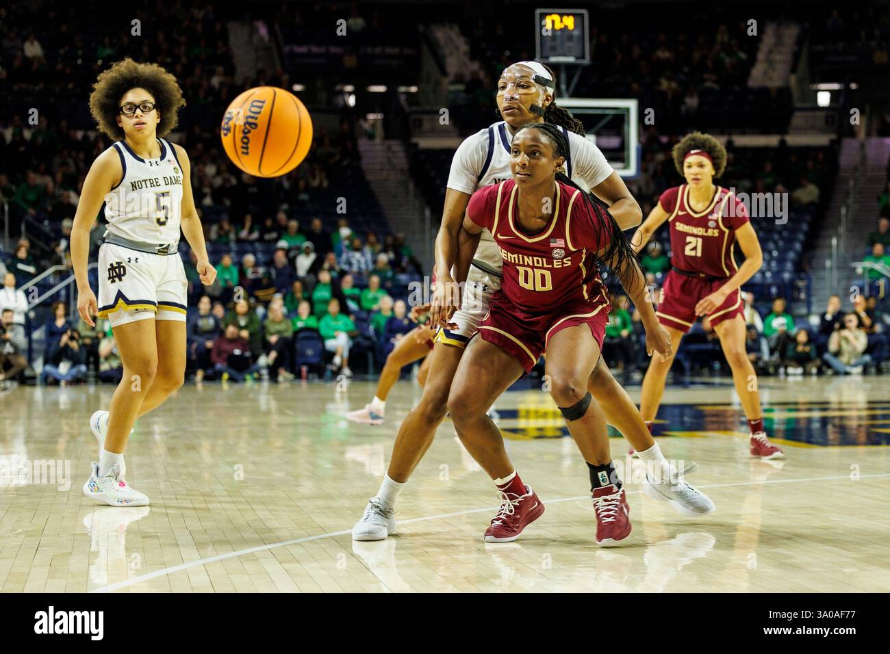 Florida State guard Ta'Niya Latson (00) and Notre Dame forward Liatu ...