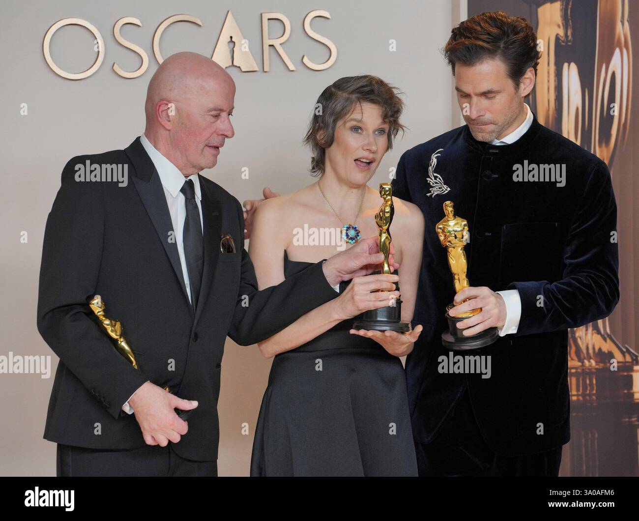 (L-R) Jacques Audiard, Camille and Clément Ducol, winners of the Best ...